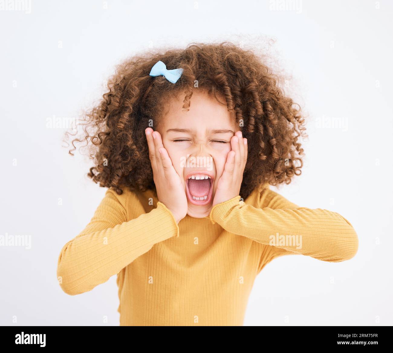 Child, scream and hands on face in studio for fear, bad news or ...