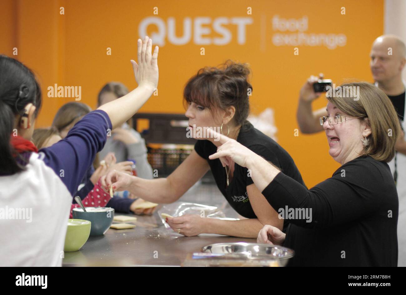 Deaf children learn how to make pizza under the help of a sign language ...