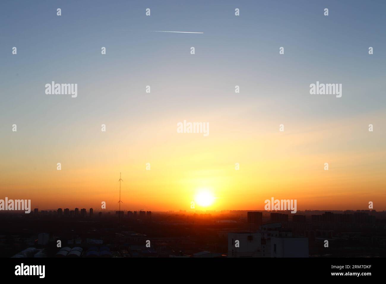 Photo taken on Feb. 27, 2014 shows the sky at sunrise in Beijing ...