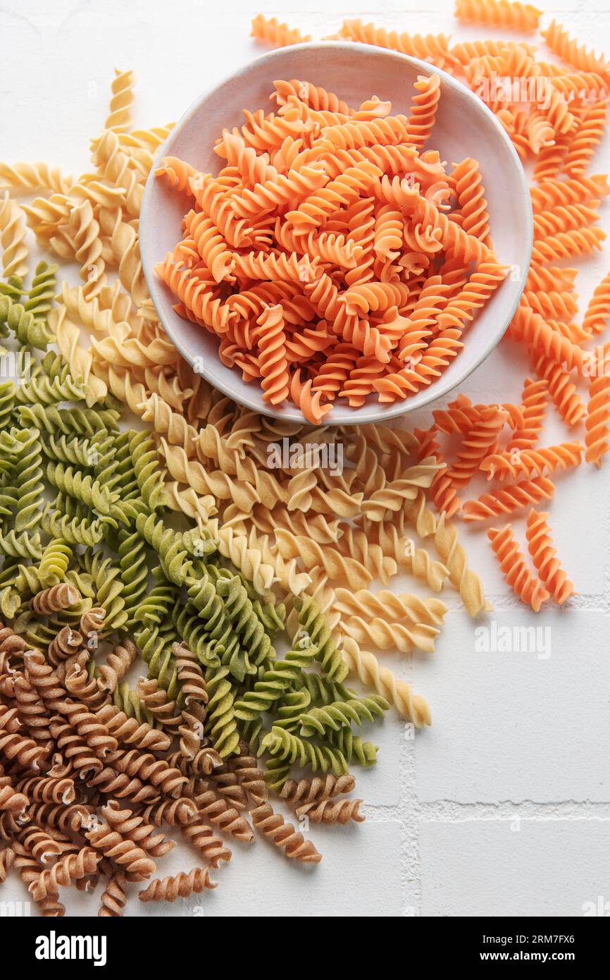 A variety of fusilli pasta made from different types of legumes, green ...