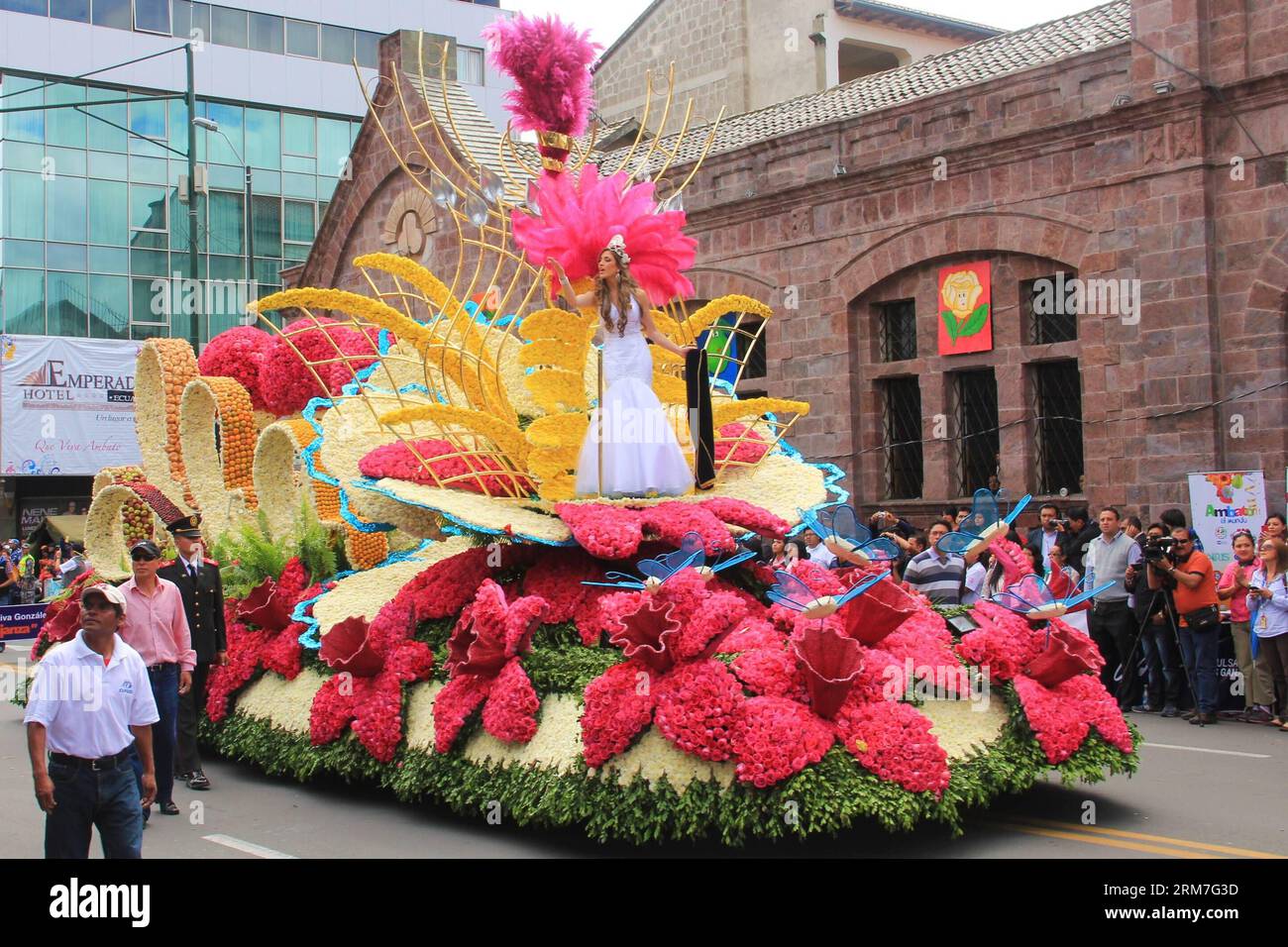 The Beauty Queen of Ambato rides on a decorated float during the parade ...