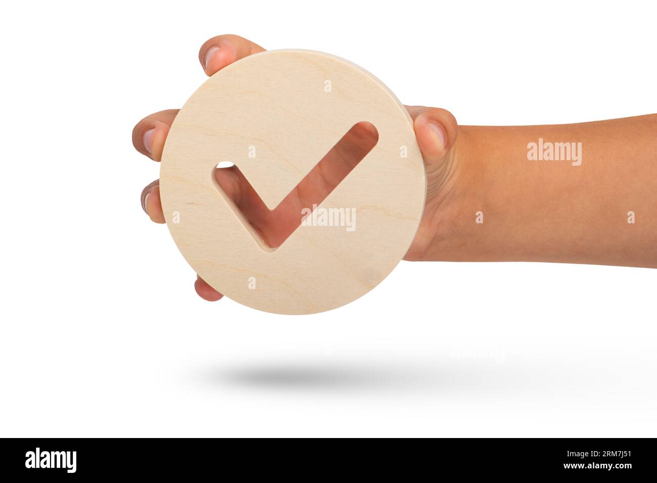 Check mark symbol on white isolated background. Big wooden round badge ...