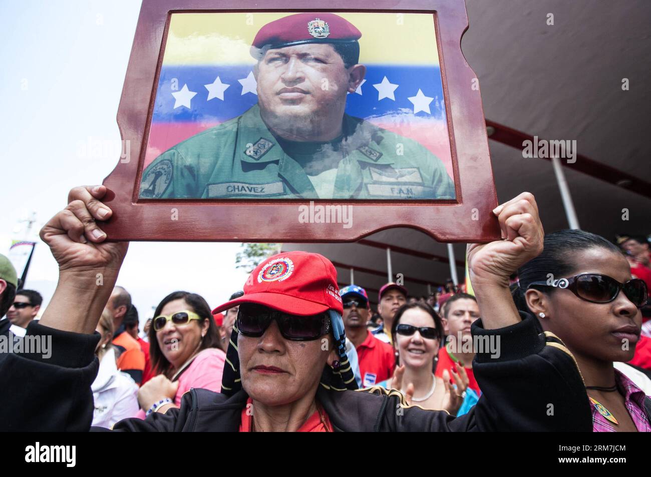 A woman holds an image during the civic-military parade in honor of ...