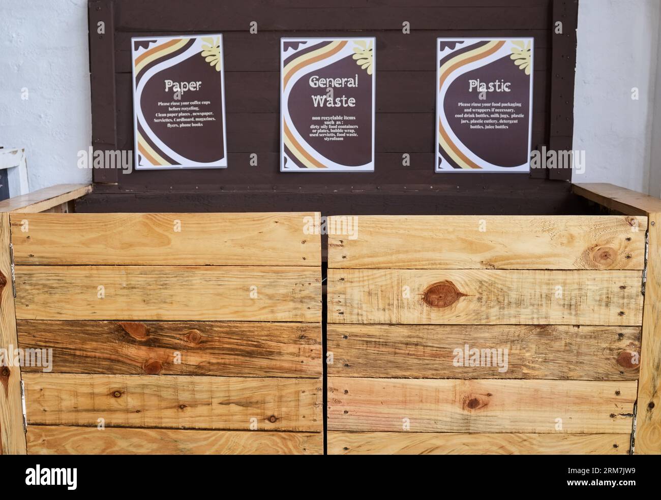 Sign, recycling and sustainability with a wooden box for paper, plastic ...