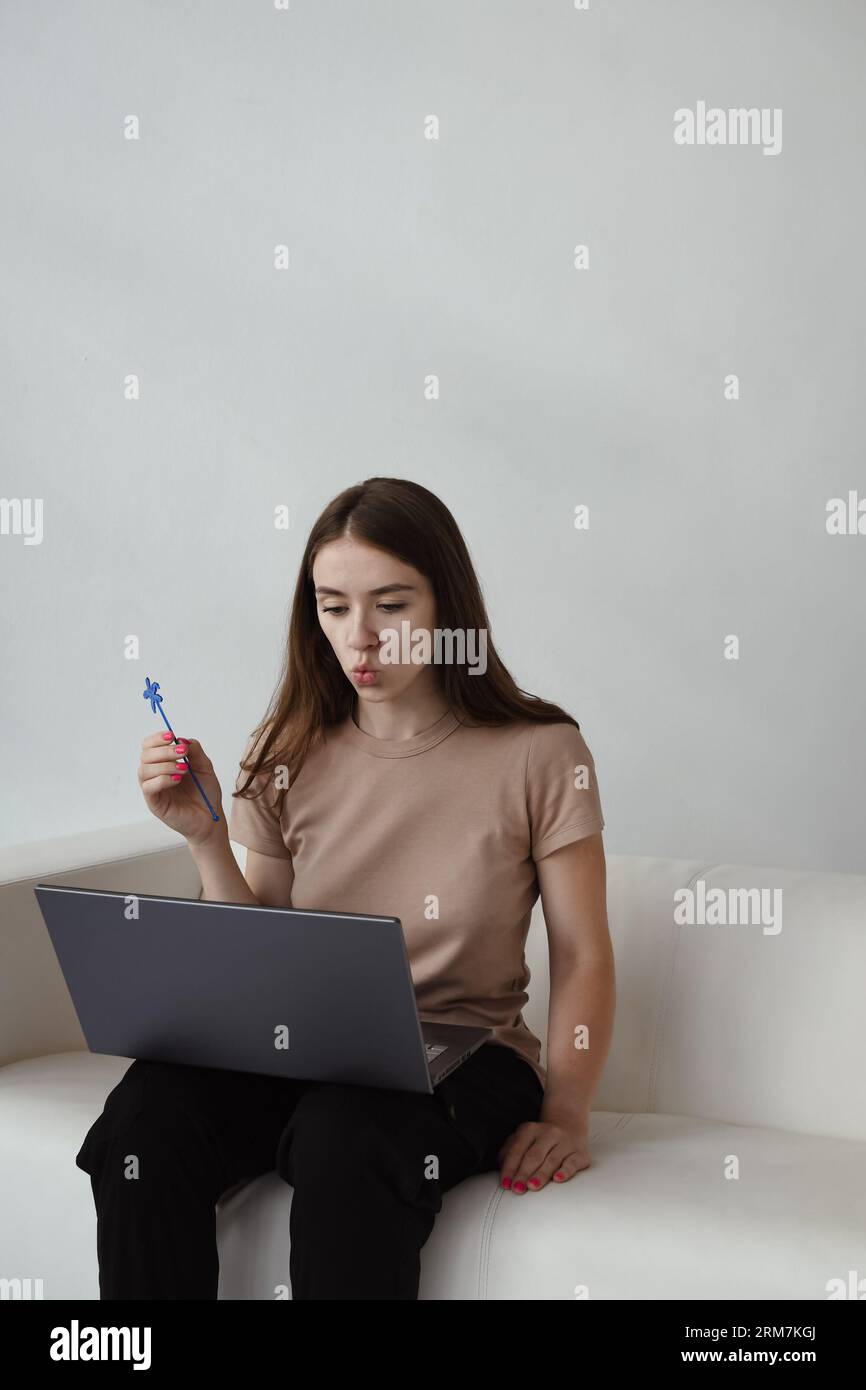 Speech therapist works with a child remotely. Speech therapy at a ...