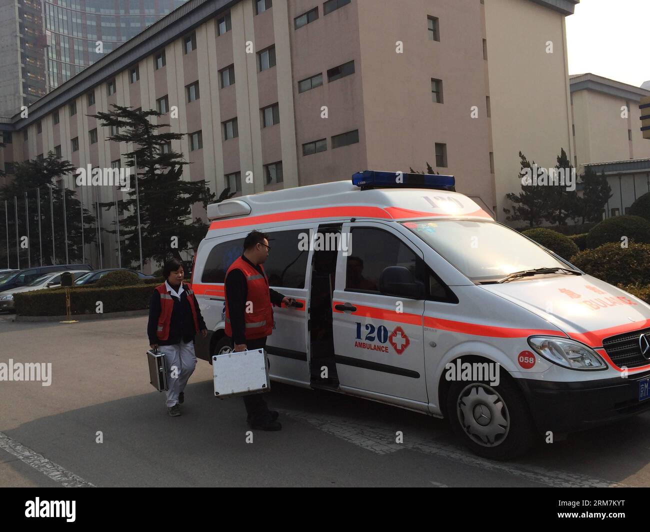 Medical workers and an ambulance wait outside the Lido Hotel, where ...