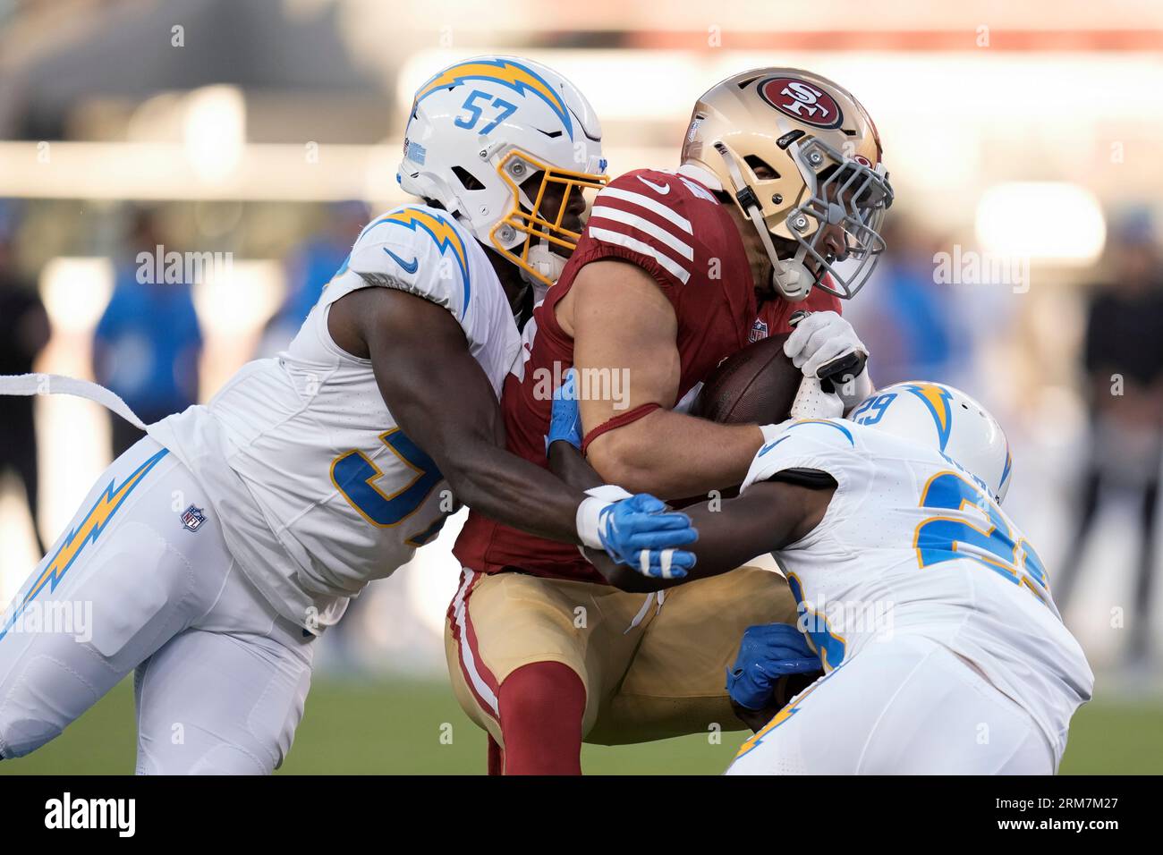 San Francisco 49ers fullback Kyle Juszczyk, center, is tackled by Los ...
