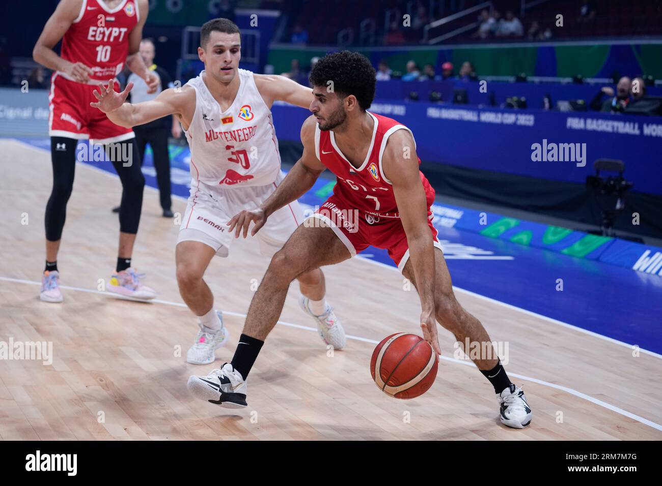 Montenegro guard Petar Popovic (30) defends Egypt guard Adam Moussa (7 ...