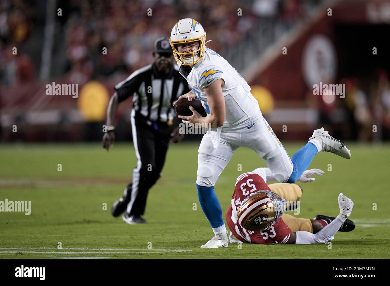 Los Angeles Chargers quarterback Max Duggan, right, gets away from San ...