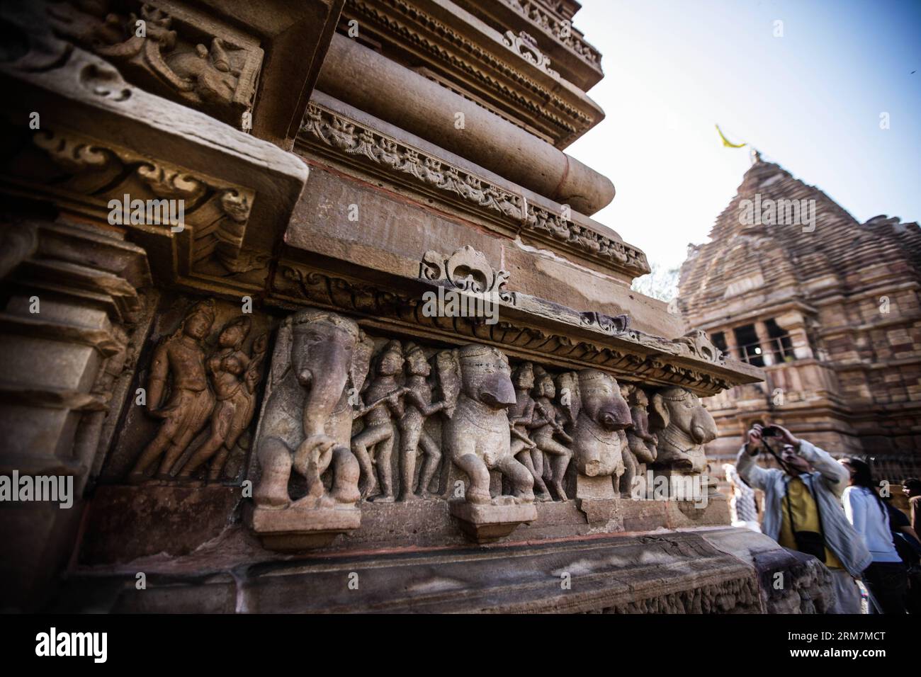 Tourists visit the Khajuraho group of monuments in Madhya Pradesh of ...
