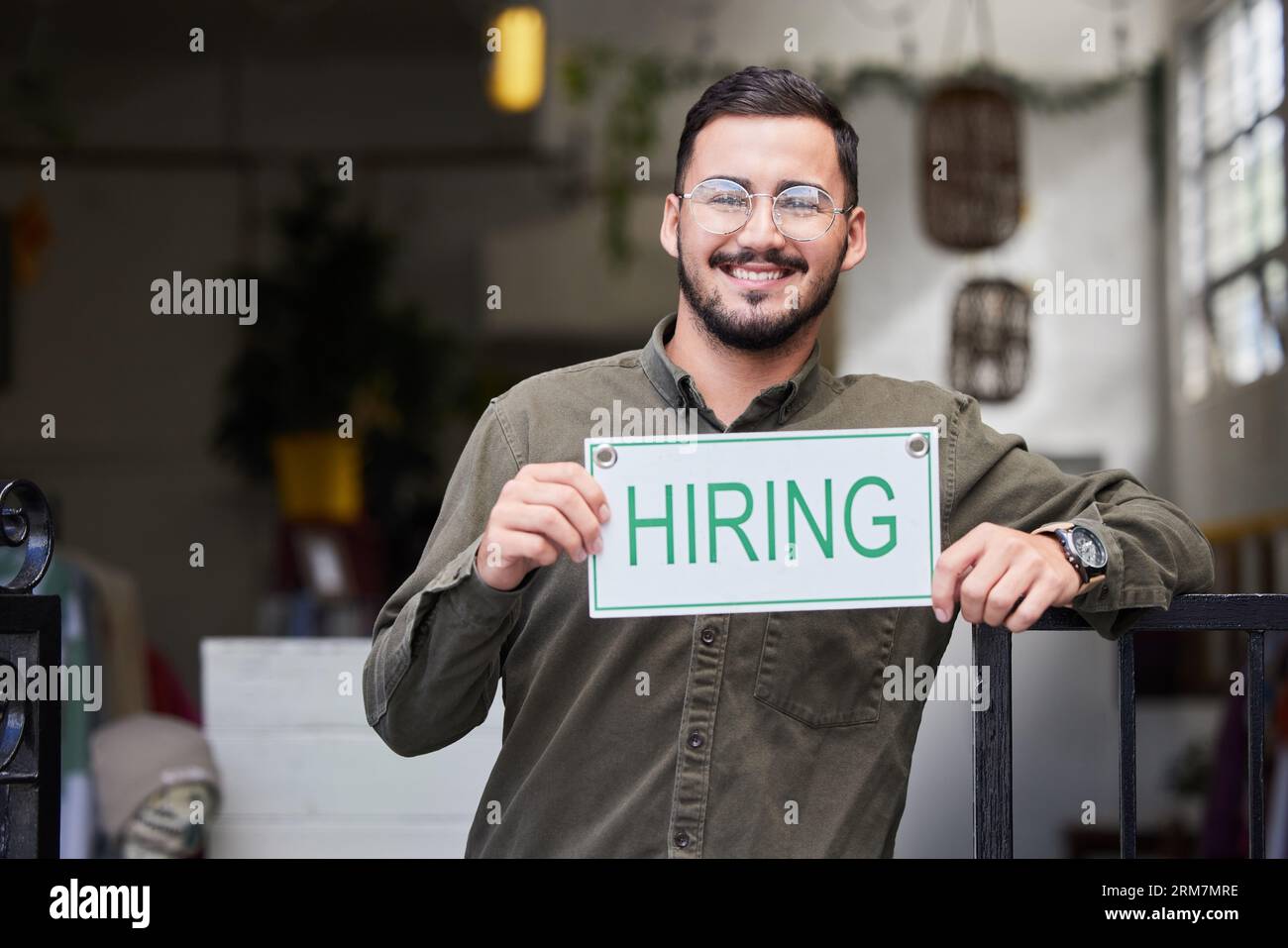 Portrait, man and we are hiring sign with recruiting, happy and smile ...