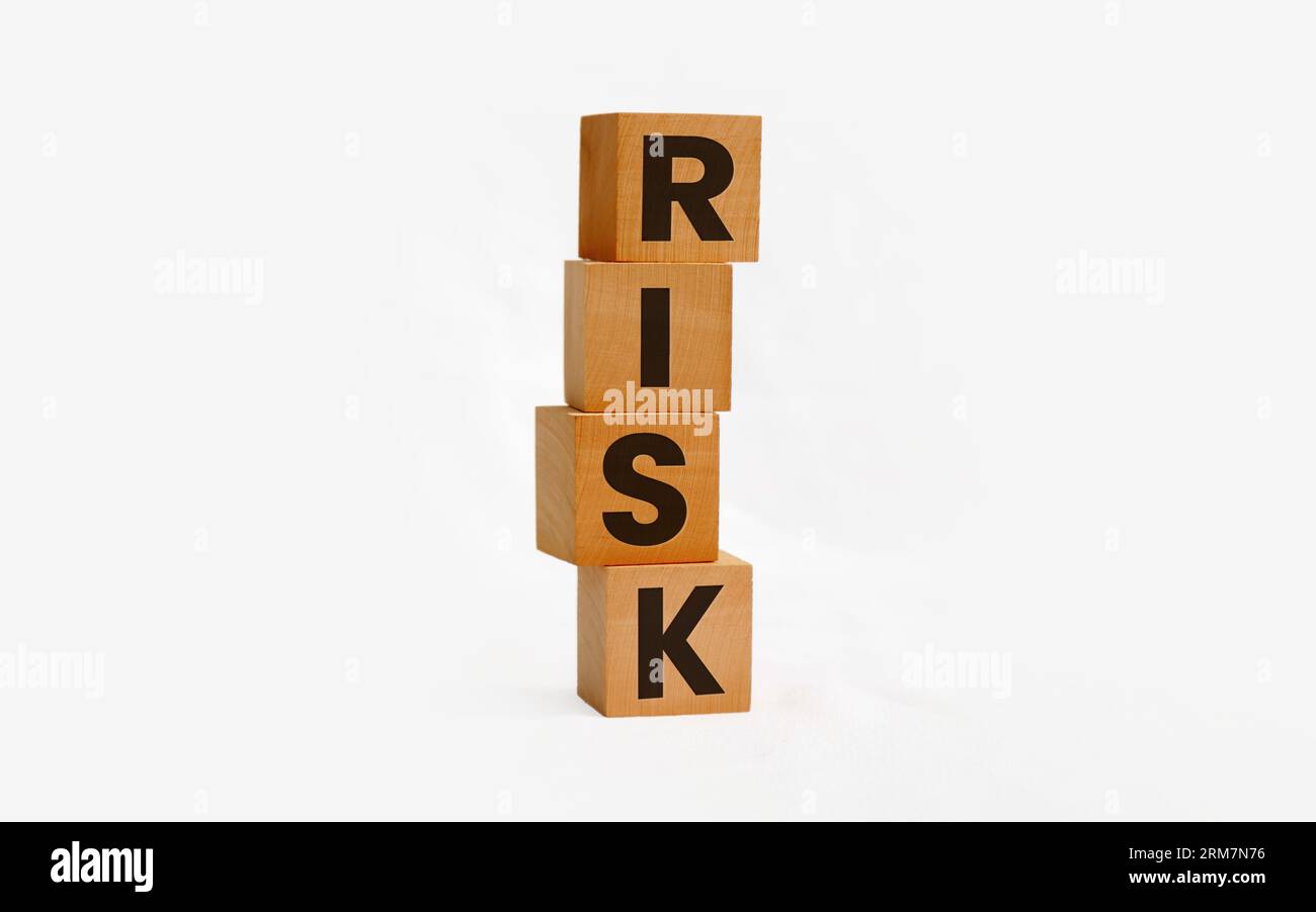Wooden block with alphabet building the word RISK. Risk assessment and ...