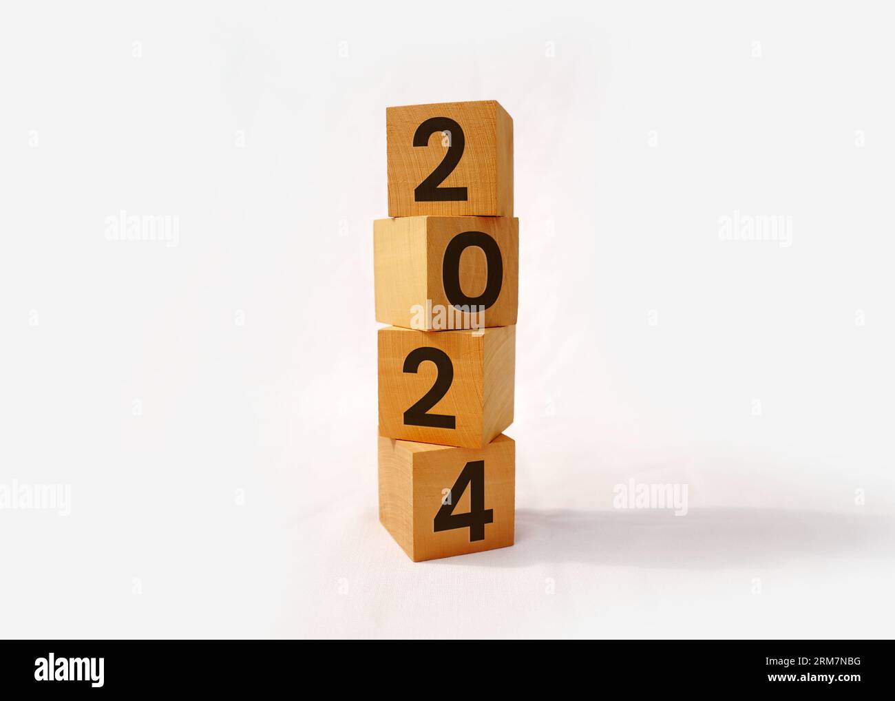 2024 Happy New year background banner. Wooden cube blocks stacked on ...