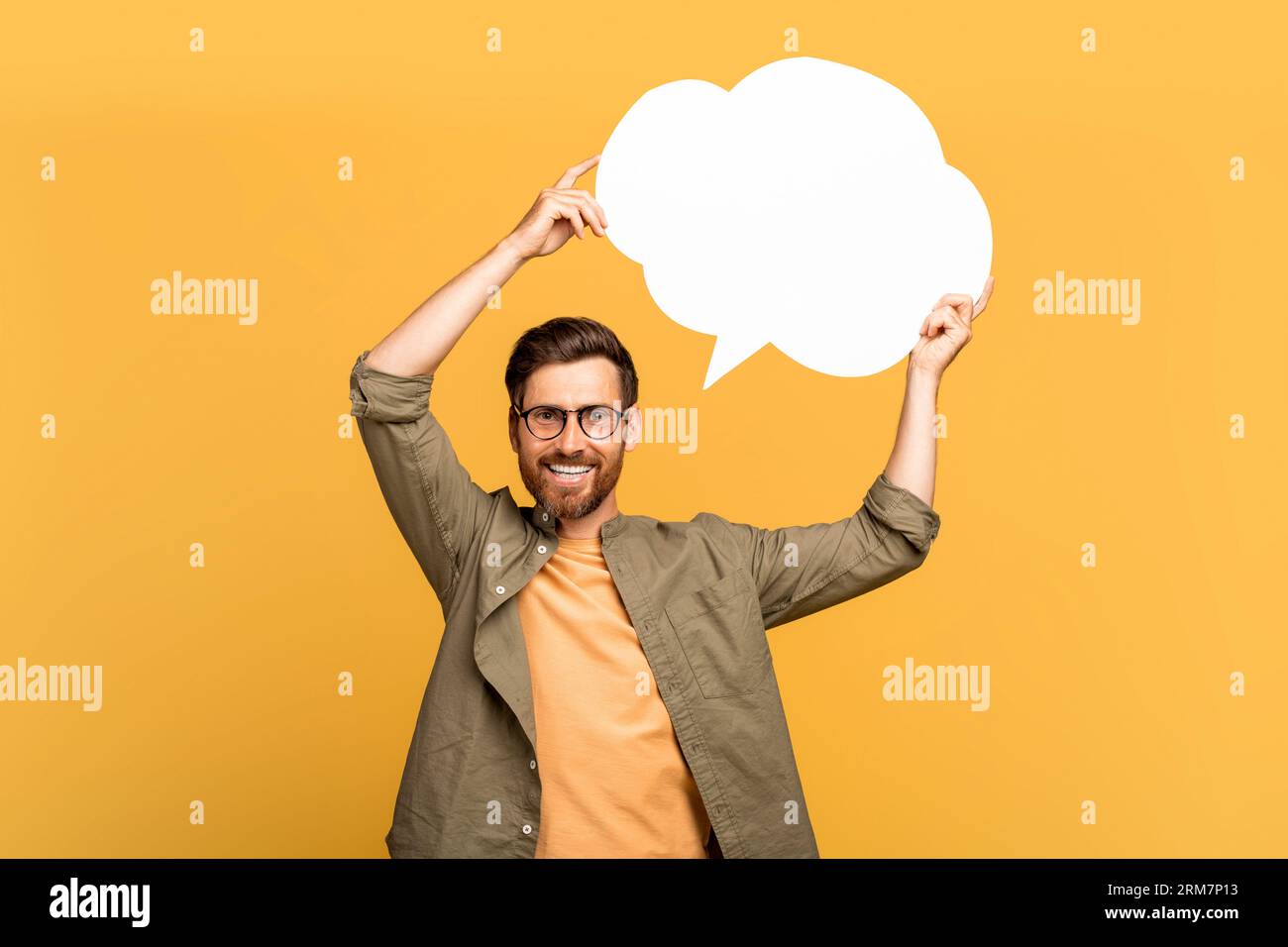 Happy european middle aged man in casual outfit holding blank ...