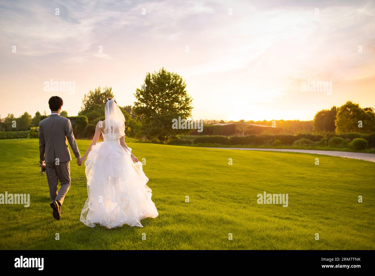Beautiful newlywed couple looking back hi-res stock photography and ...