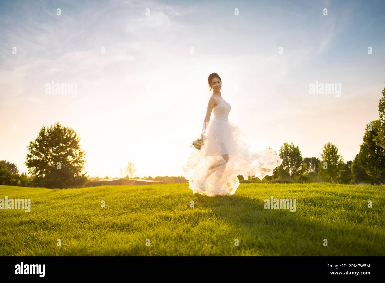 Young woman dancing on grass hi-res stock photography and images - Alamy