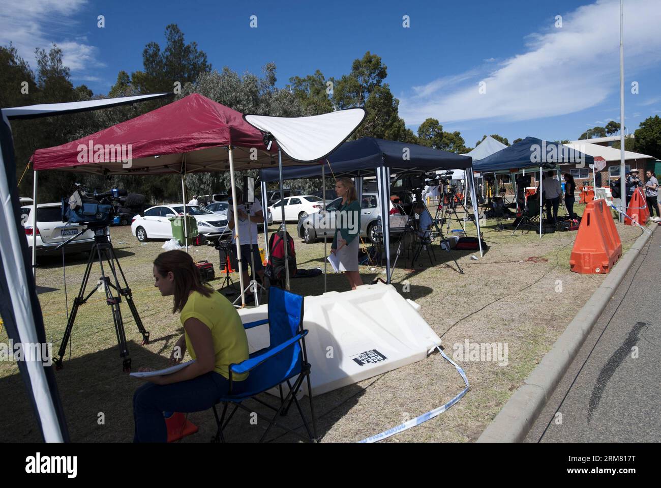 Journalists wait at the Royal Australian Air Force Pearce base in north ...