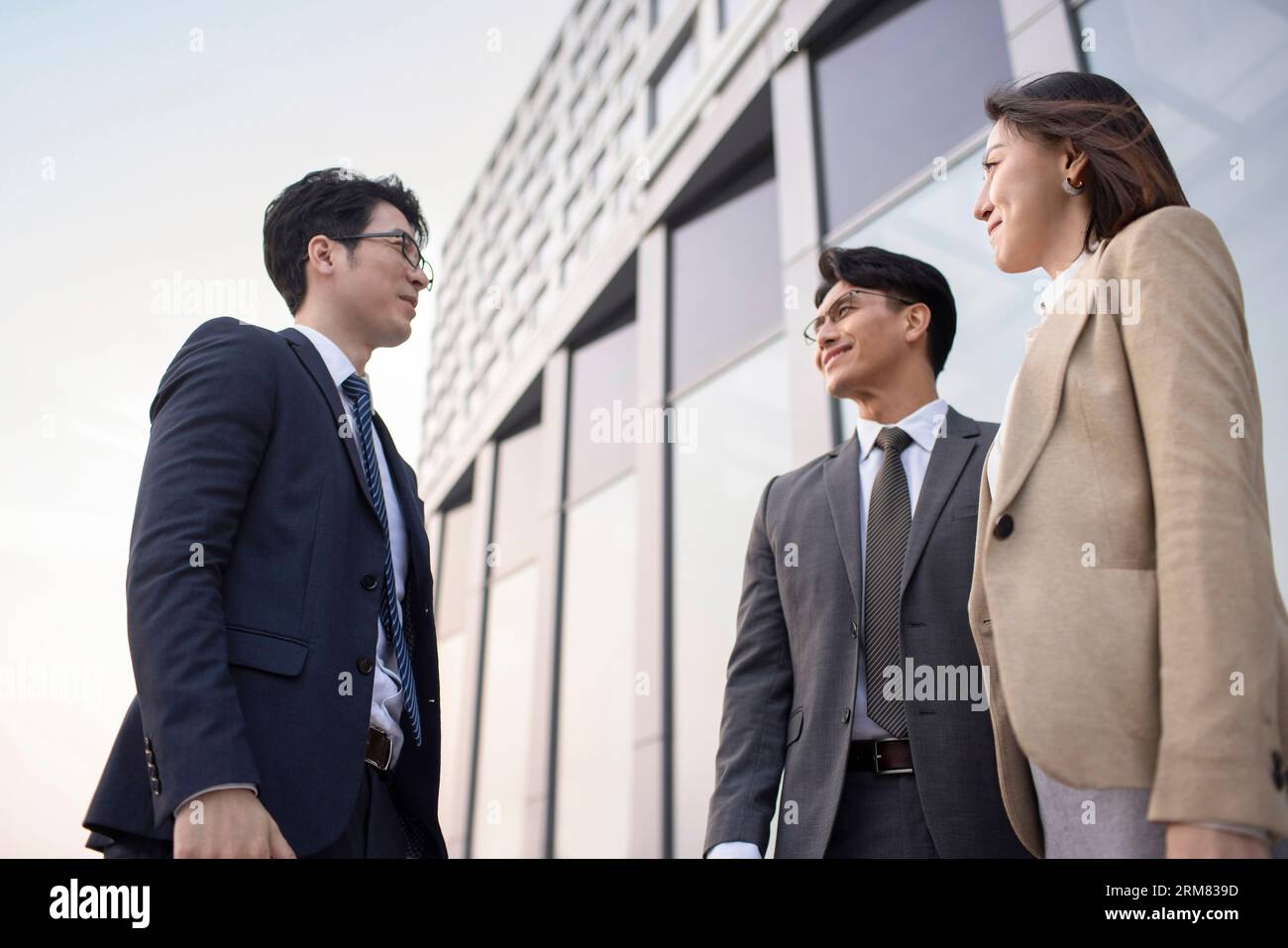Business people talking outdoors Stock Photo - Alamy