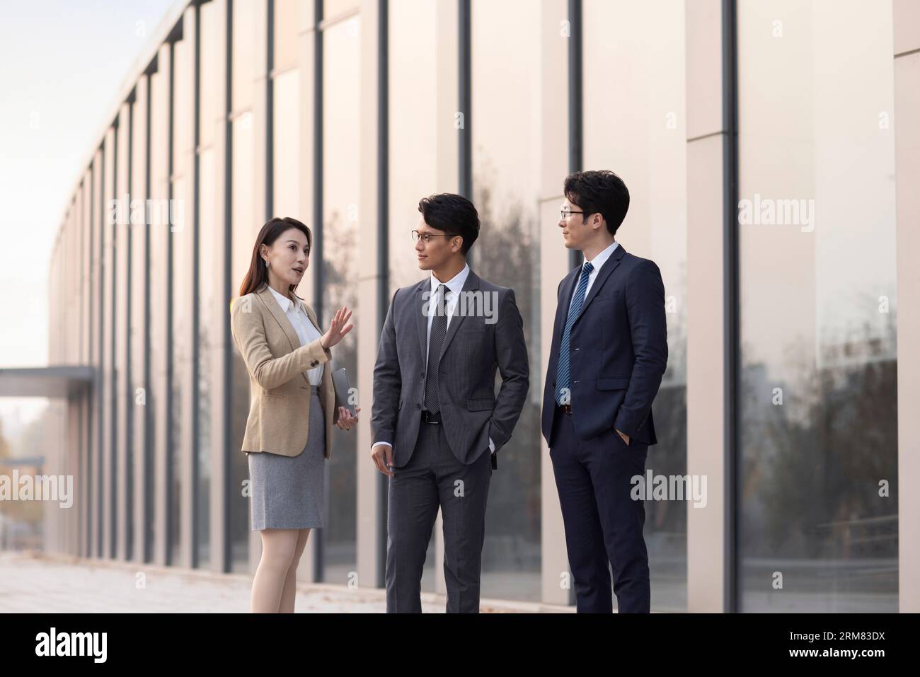 Business people talking outdoors Stock Photo - Alamy
