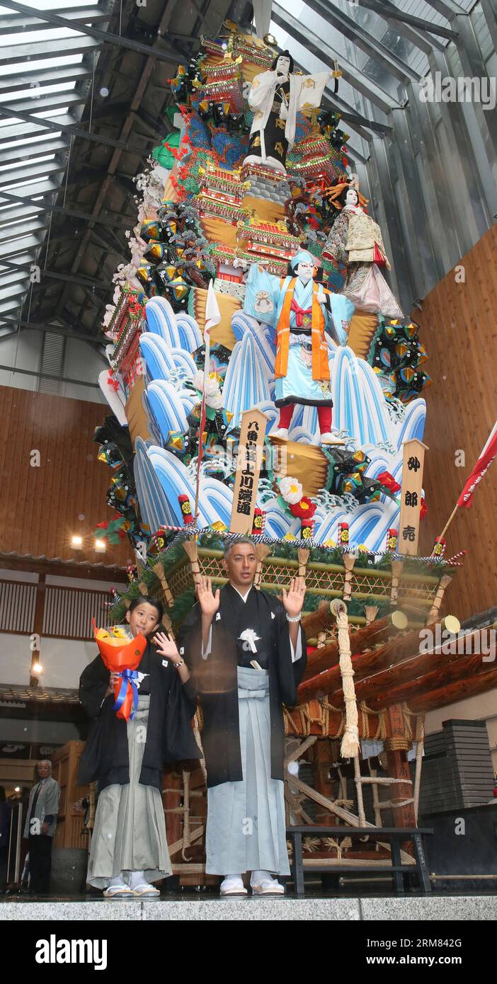 Japanese Kabuki actor Ichikawa Danjuro XIII (R) poses for photo with ...