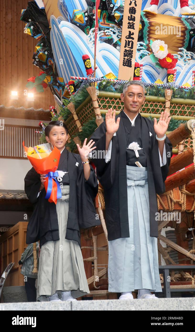 Japanese Kabuki actor Ichikawa Danjuro XIII (R) poses for photo with ...