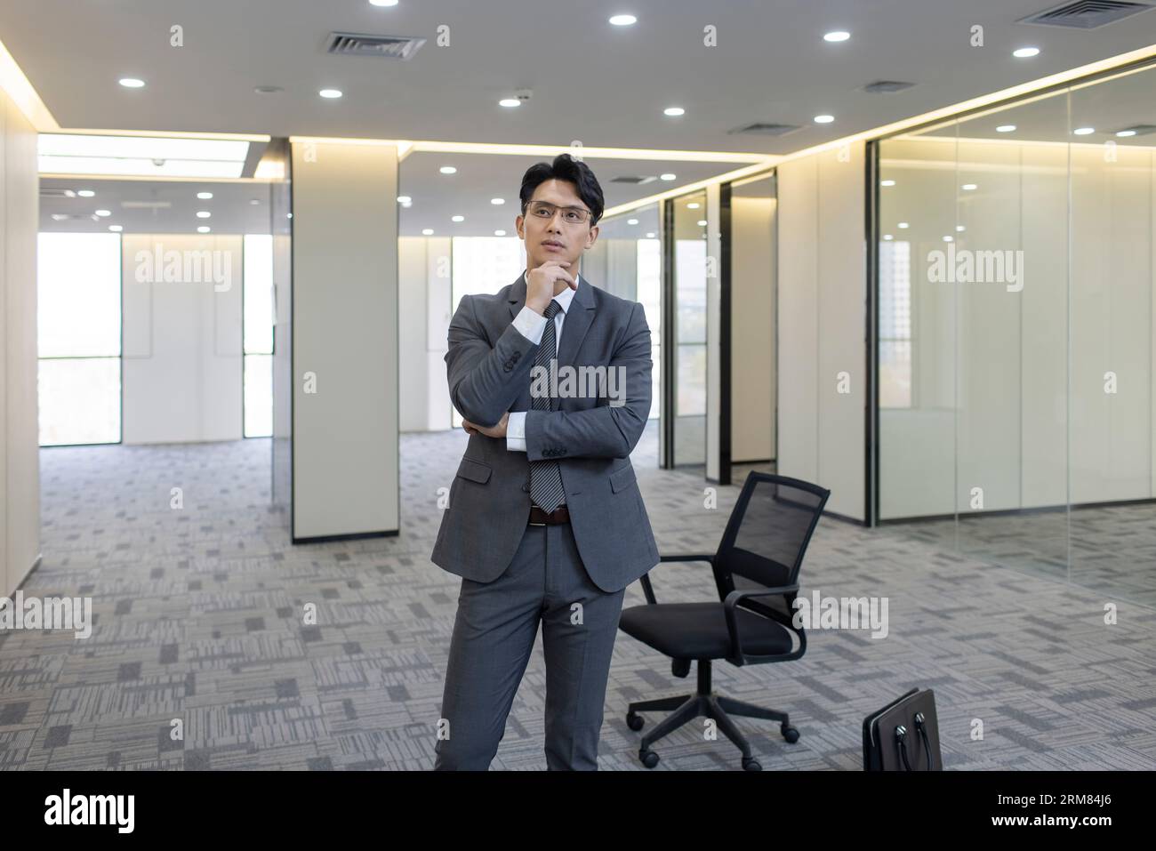 Empty office chair and briefcase hi-res stock photography and images ...