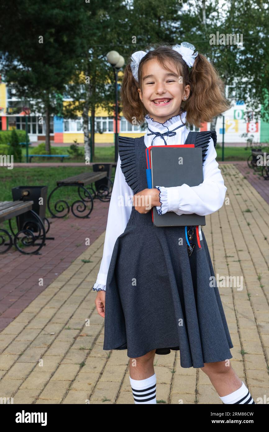 Children reading school books uniform hi-res stock photography and ...