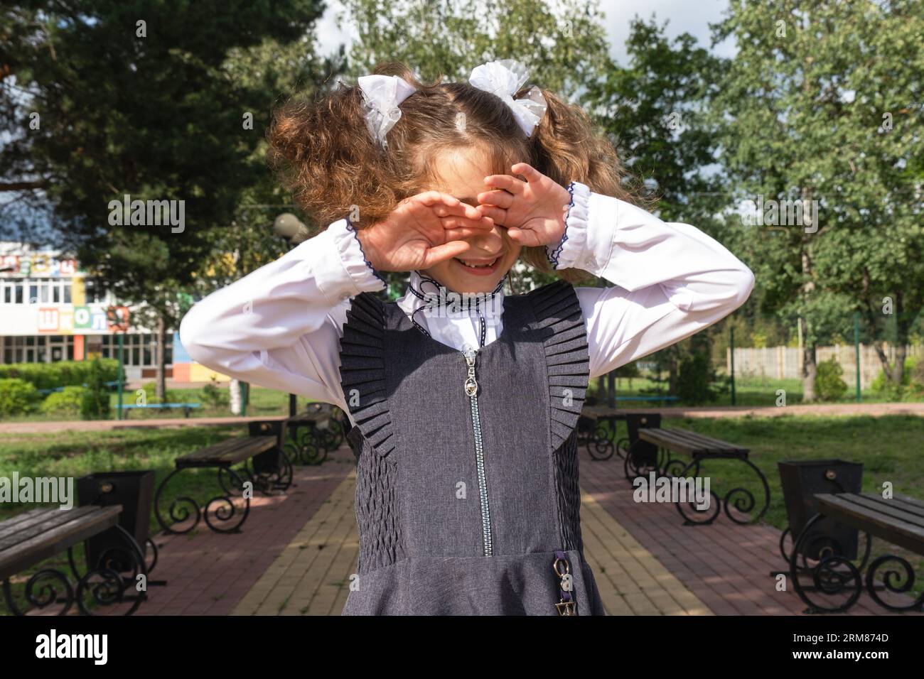 Girl with a backpack near the school after classes, unhappy, tired and ...