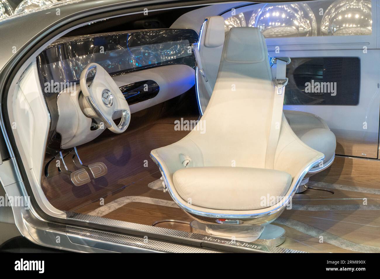 White leather armchair in the car. Interior inside. Driver's seat ...