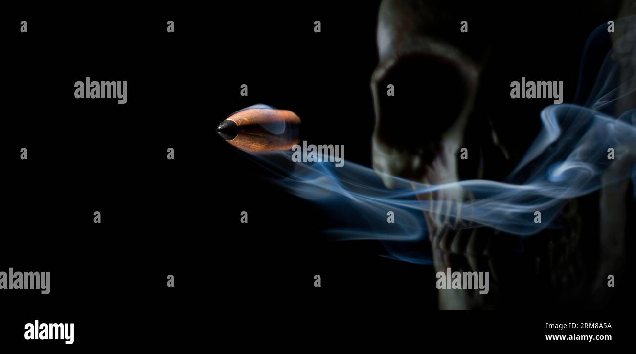 Dangerour encounter with a grim reaper shooting smoking bullets Stock ...