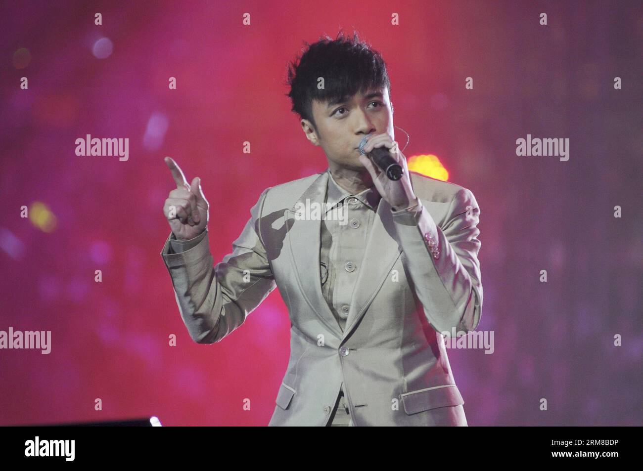 Singer Ku Kui Kei sings at a charity concert marking action movie actor ...