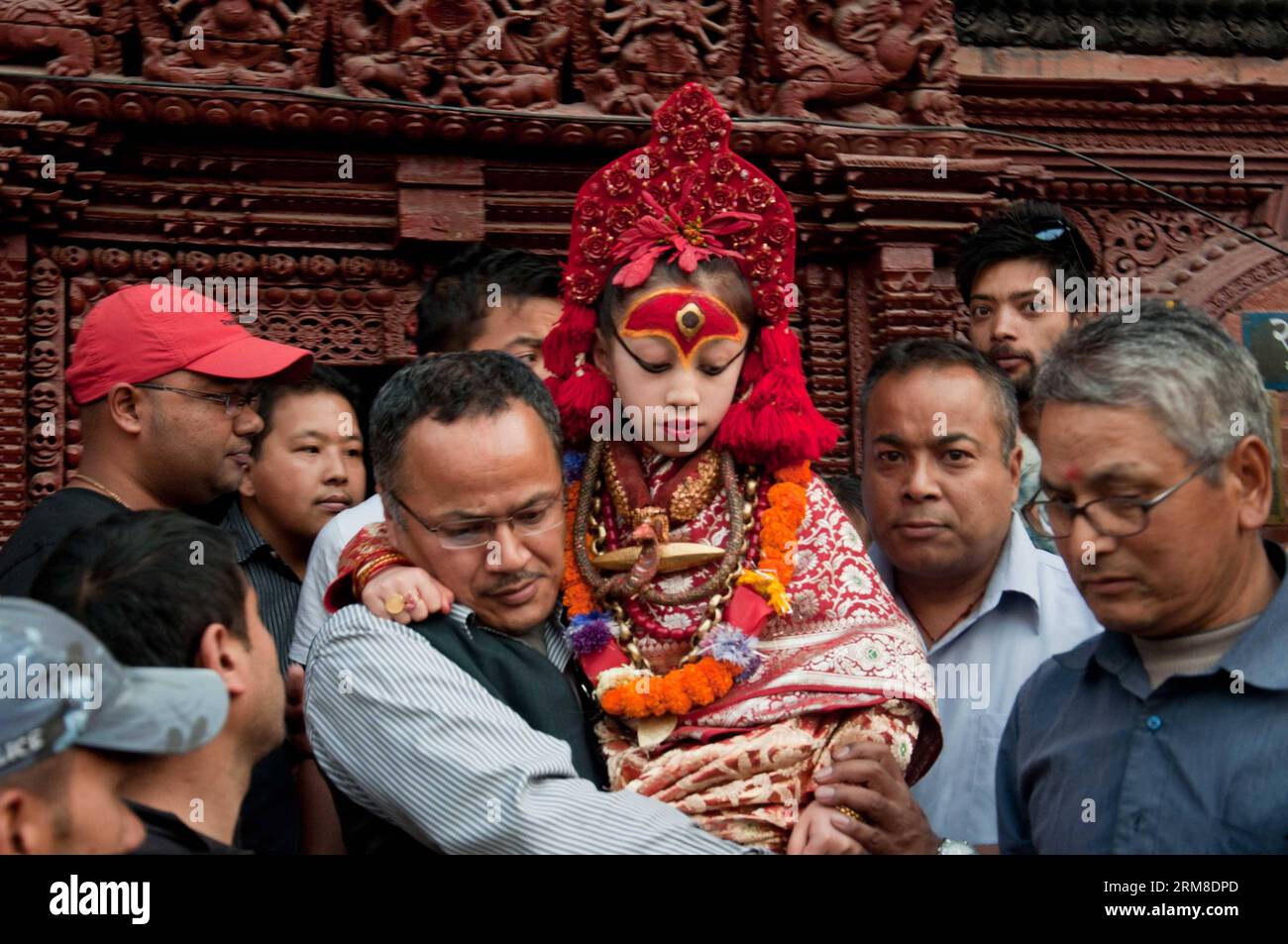 KATHMANDU, A girl dressed as Goddess Kumari is carried at Kumari house during the Seto ...