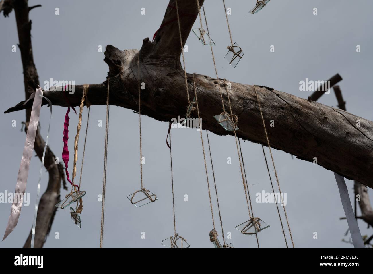 Symbolic group of pieces of the glass on the strings and color ribbons ...