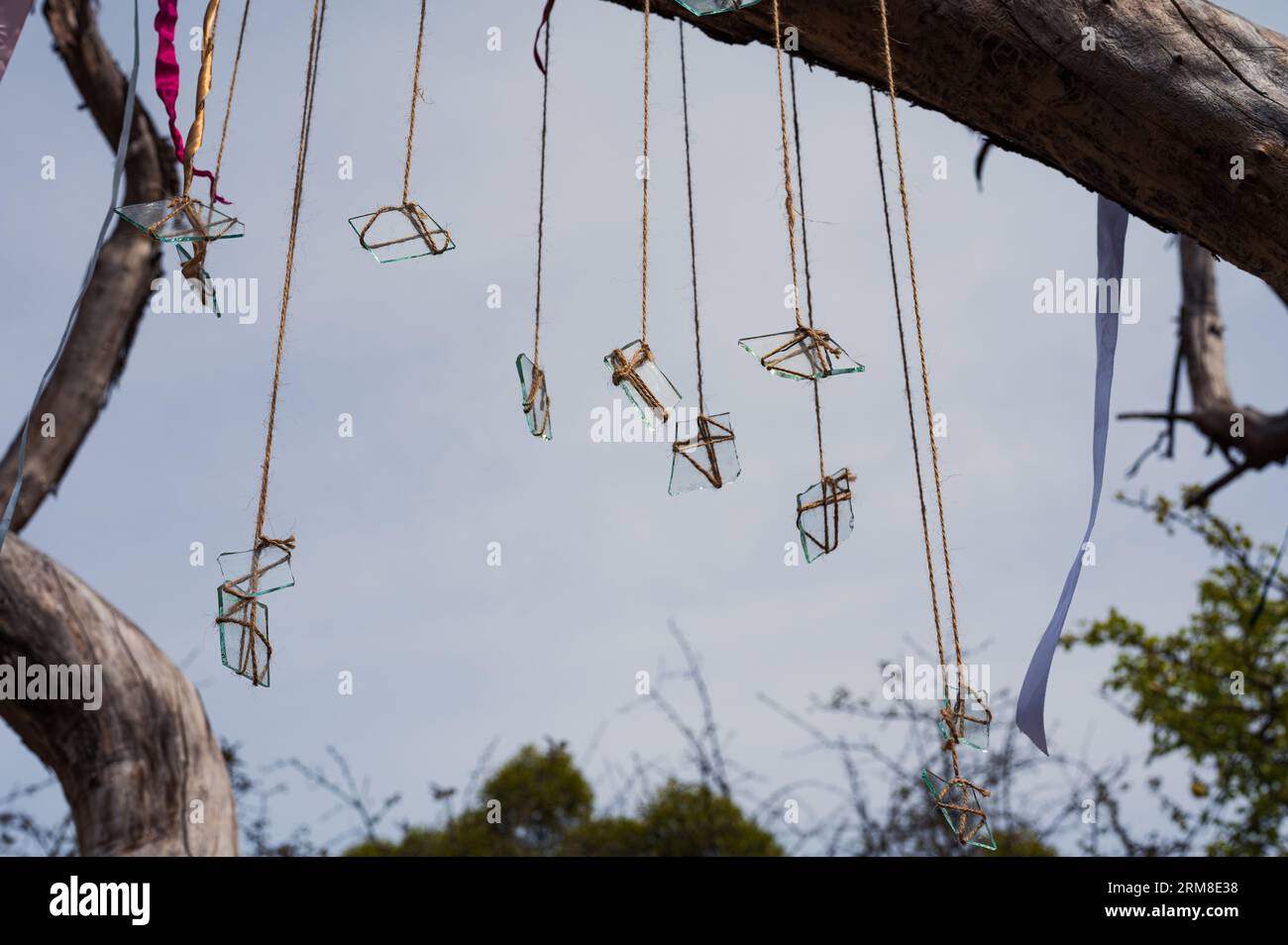 Symbolic group of pieces of the glass on the strings with the sky and ...
