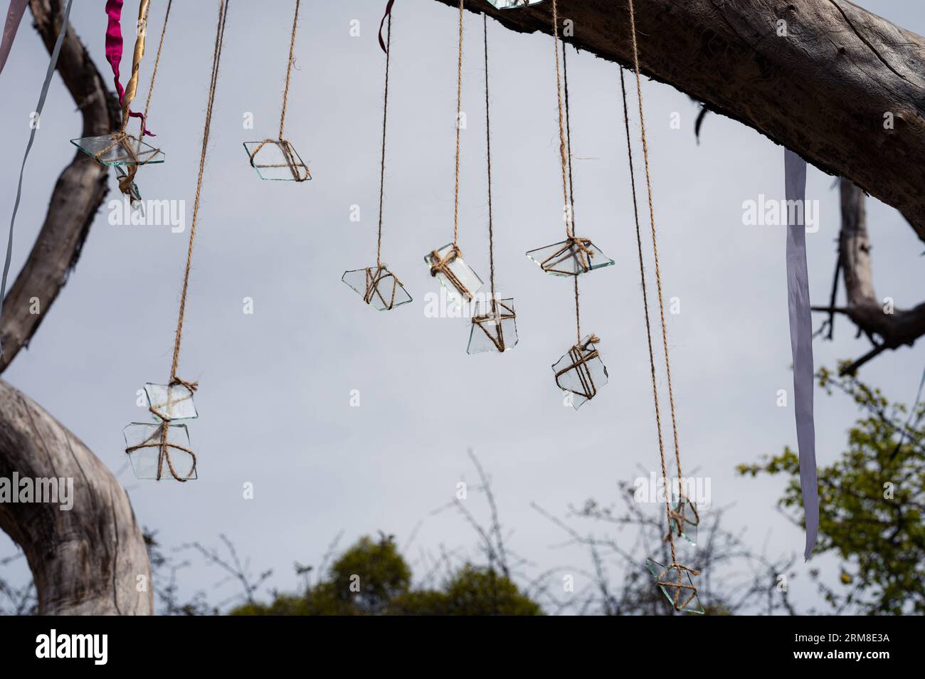 Symbolic group of pieces of the glass on the strings and white ribbon ...