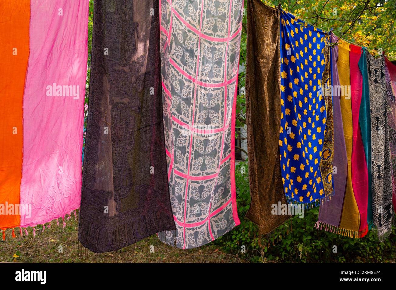 Group of colorful shawls kerchiefs on the string. Abstract, decor ...