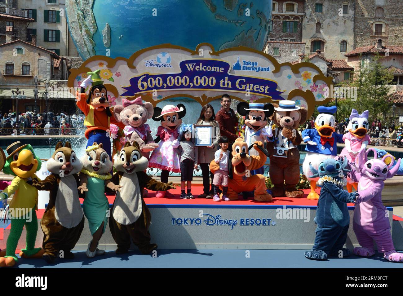 Yumi Sakai (5th L, on stage) celebrates with her family and Disney ...