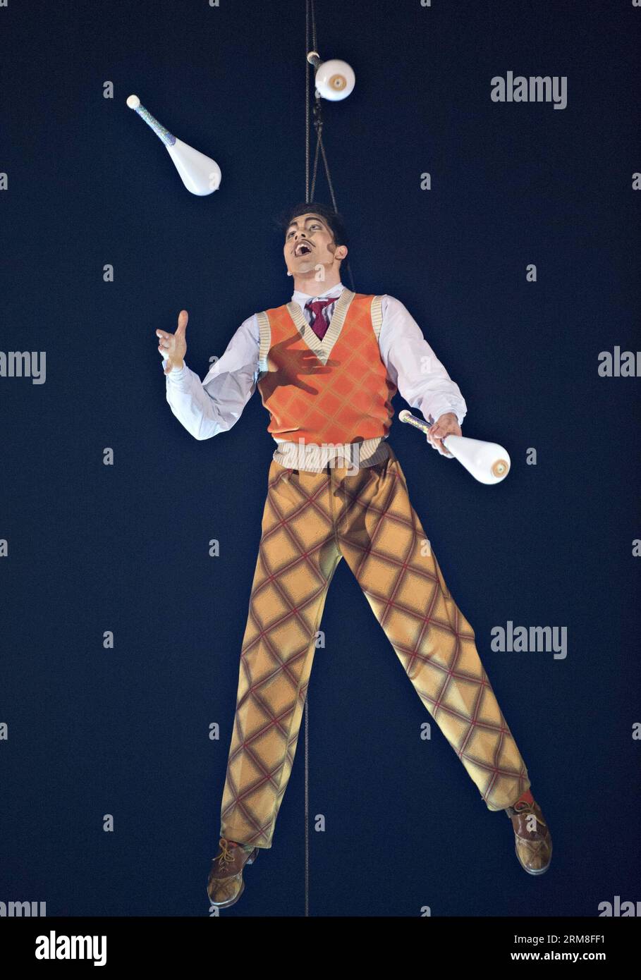 An acrobatic actor of Cirque du Soleil performs Kurios-Cabinet of ...