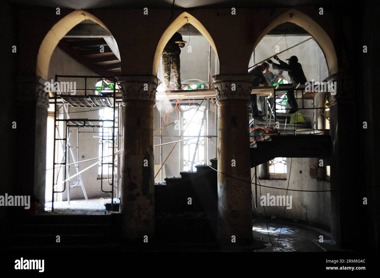 Workers restore the interior of the Old Synagogue in Harbin, capital of ...