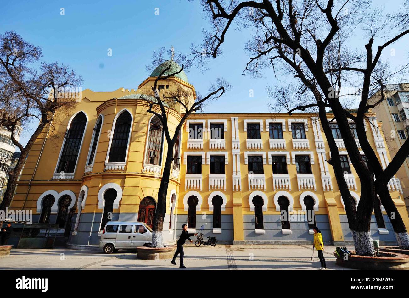 Residents play badminton outside the renovated Old Synagogue in Harbin ...