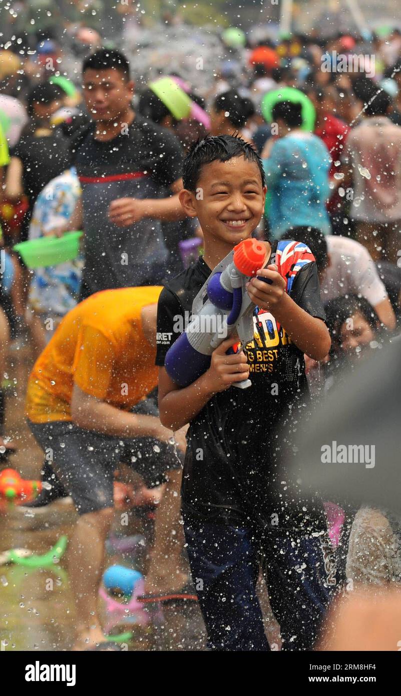 People have fun with water during the Water-splashing Festival in ...