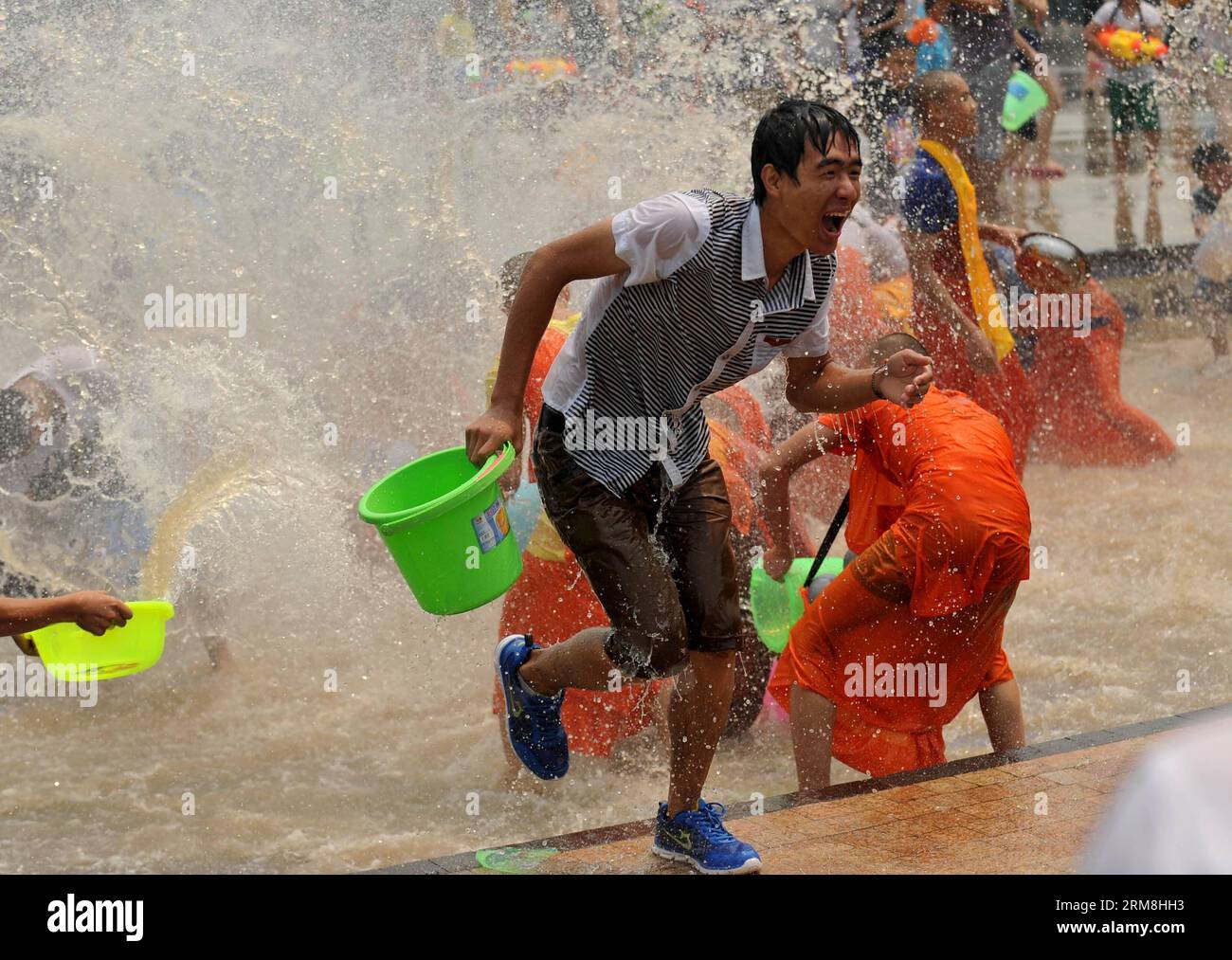 Locals and tourists have fun with water during the Water-splashing ...