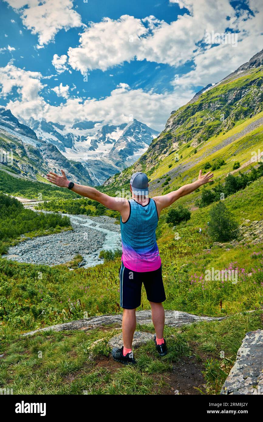 Tourist man raises hands up hi-res stock photography and images - Alamy