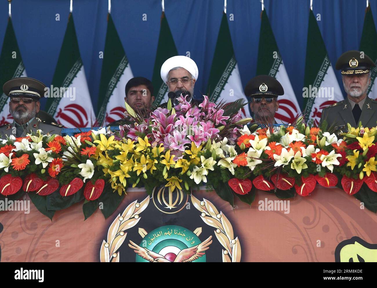 Iranian President Hassan Rouhani (C) addresses a ceremony marking the ...