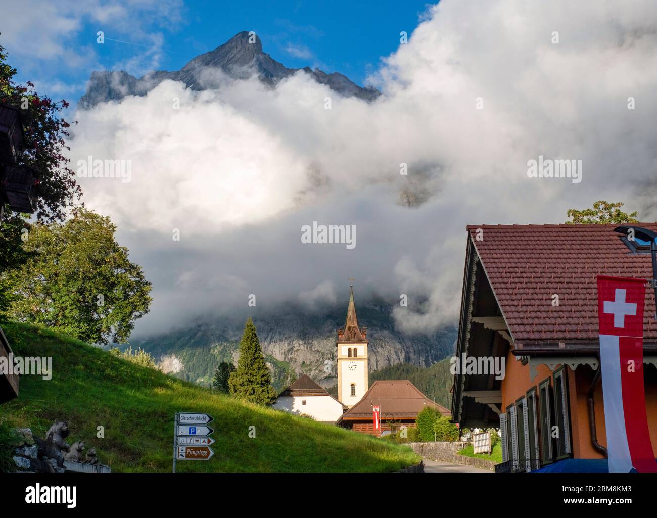 Grindelwald church with the Wetterhorn mountain behind, Bernese Alps ...