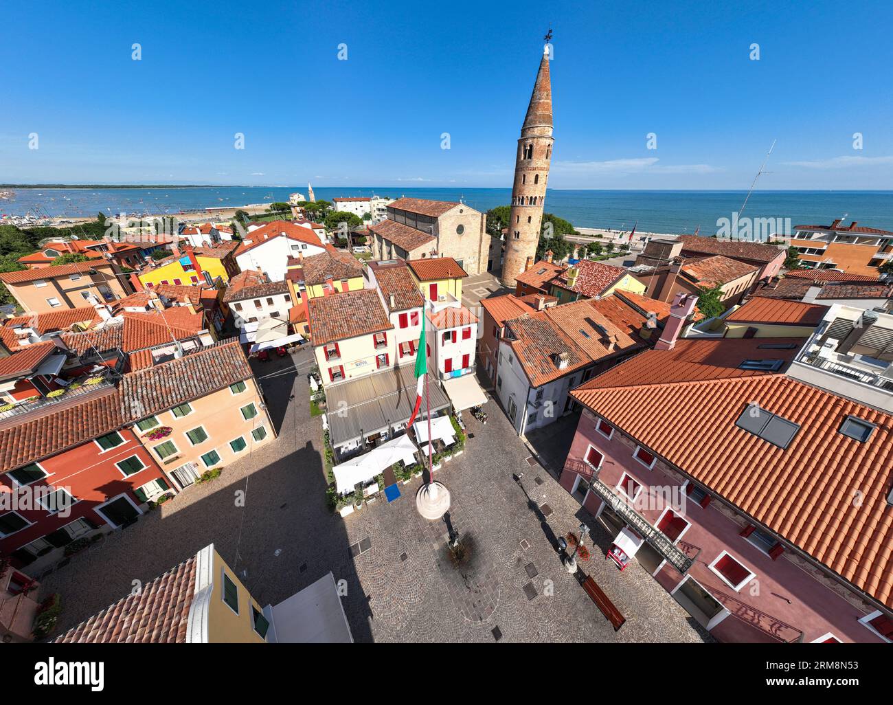 Aerial shot of a Caorle, the Resort sea beach city near to Venice. Red ...