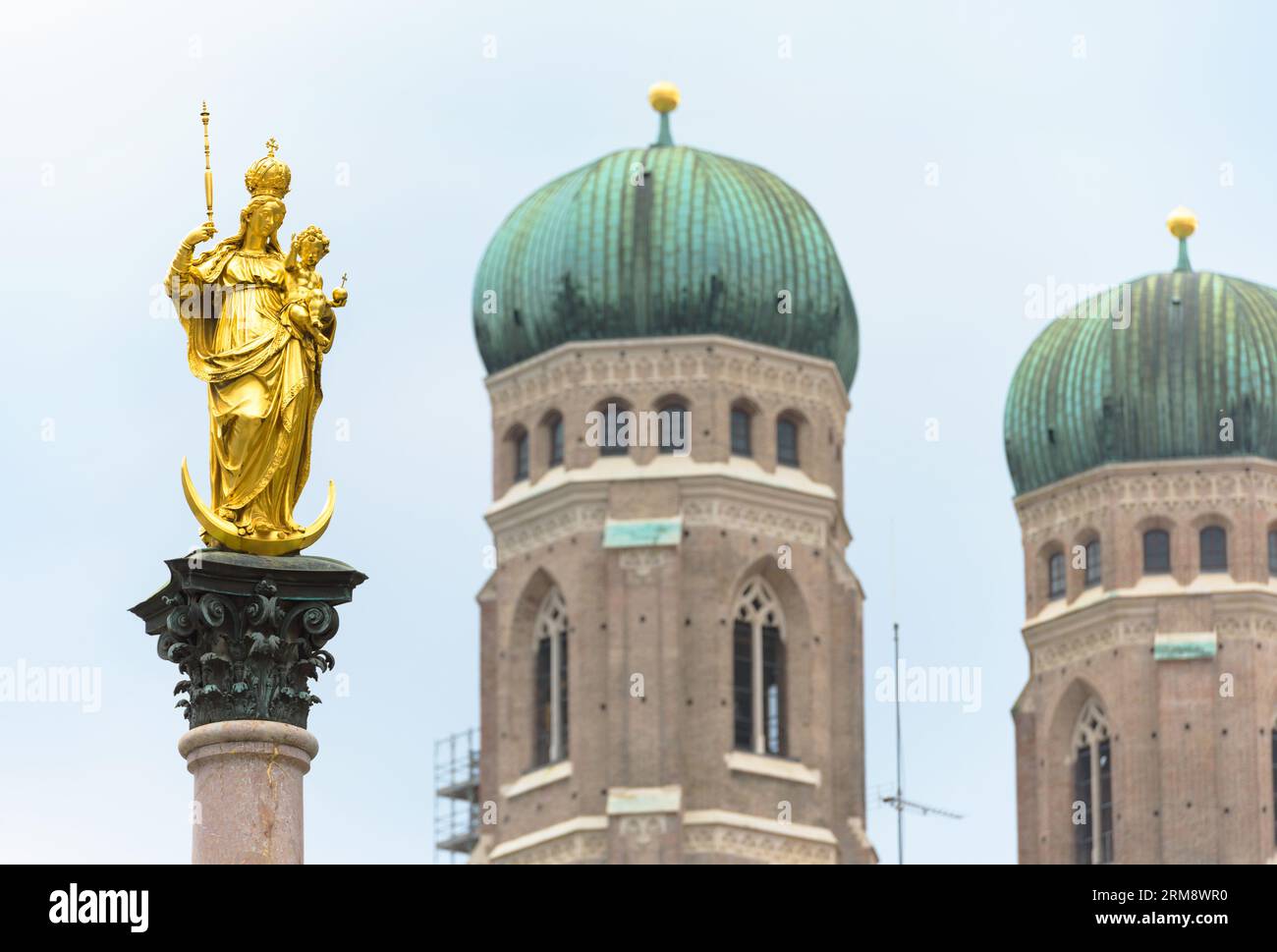 Virgin Mary statue on sky background at Marienplatz, Munich, Germany ...