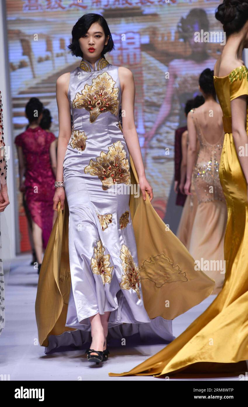 Models present creations during the 2014 China (Qingdao) International ...