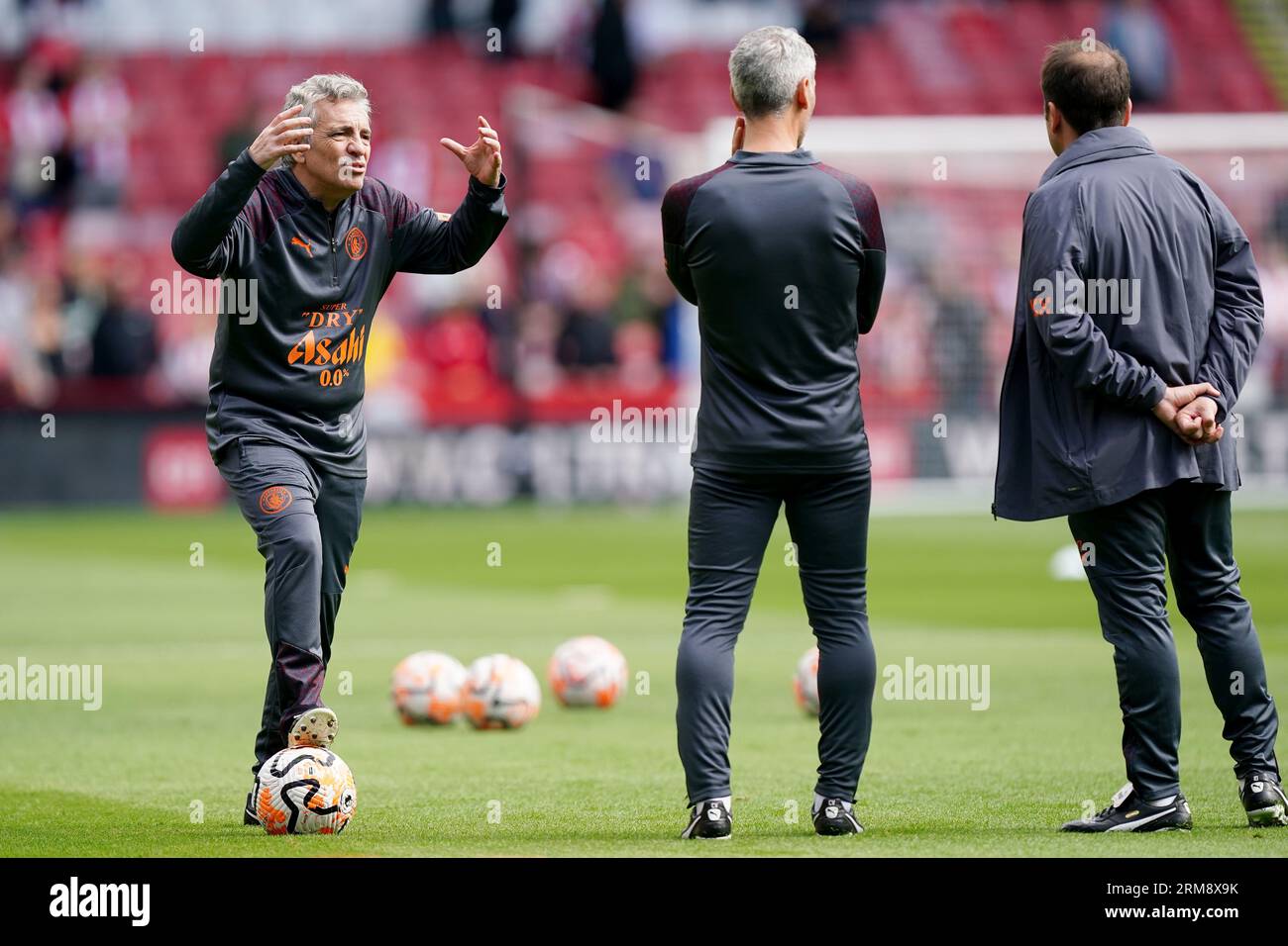Manchester City Assistant Manager, Juanma Lillo, interacts with his ...