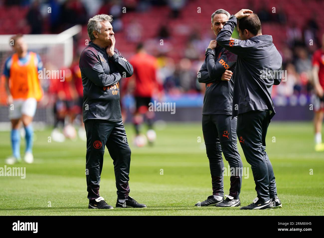 Manchester City Assistant Manager, Juanma Lillo, (left) interacts with ...